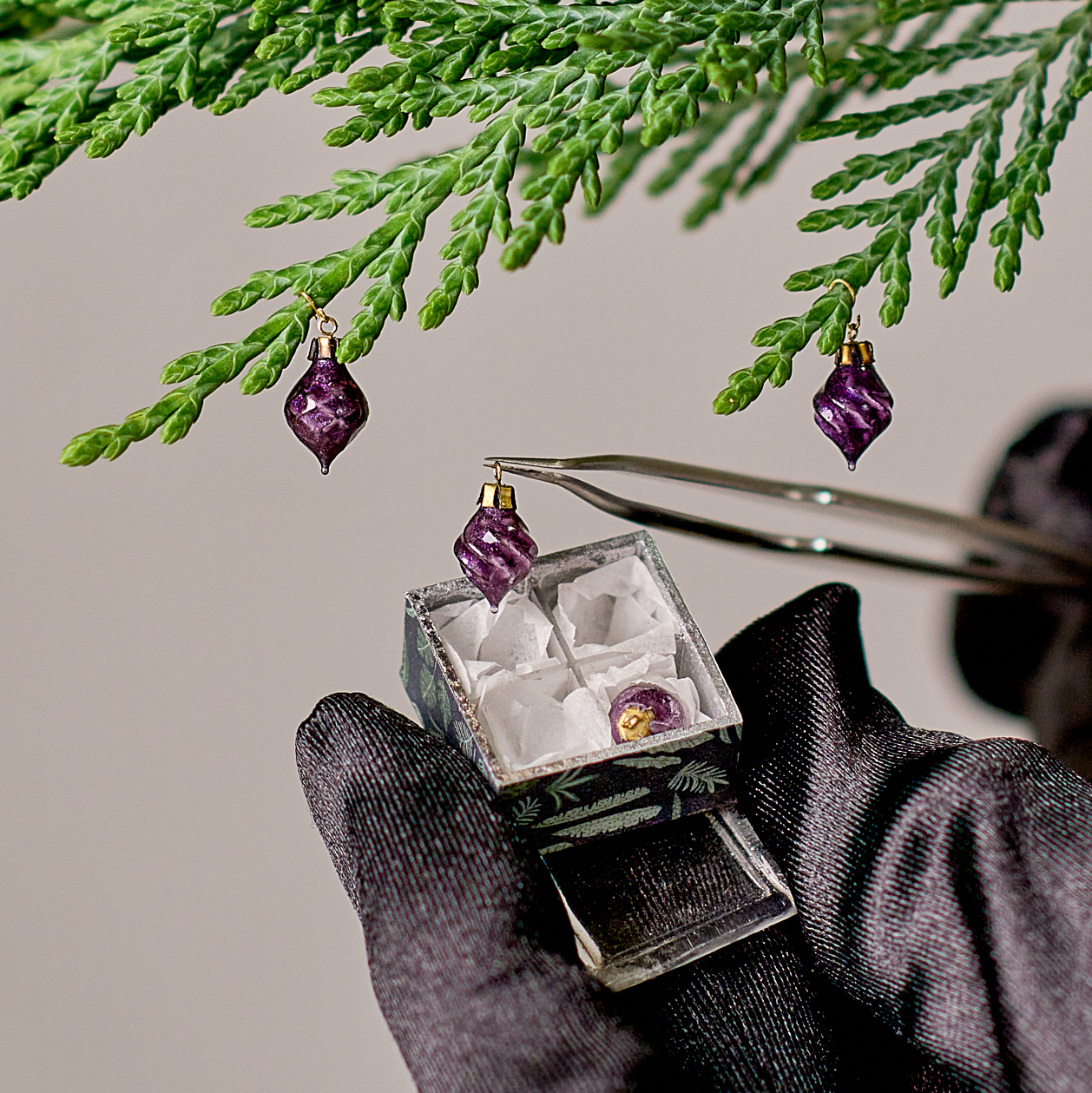 Christmas ornaments set in the box. Violet with indigo sparkling effect ...